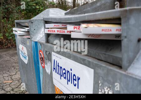 Empty, used pizza boxes, Take Away, in a full waste paper container ...
