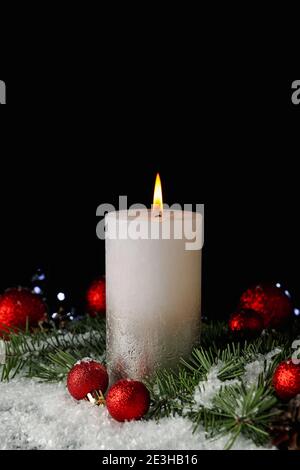 Glass holder with aroma candle and pine cones on light background Stock ...
