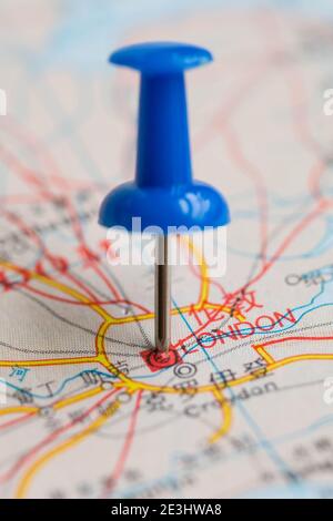 Map of London with a blue pushpin stuck Stock Photo - Alamy