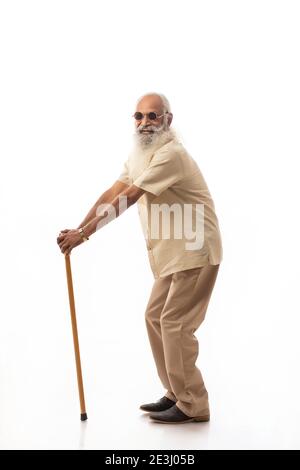 Ecstatic man dancing in front of turquoise wall during sunny day Stock ...