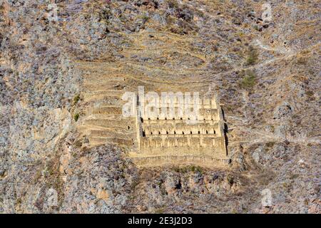 Mountainside qullqas (storehouses) on Pinkuylluna, Ollantaytambo, an ...