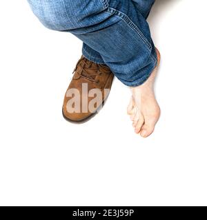 one foot with shoe and one barefoot Stock Photo - Alamy