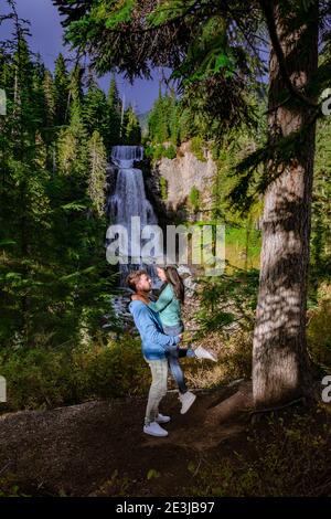 Alexander Falls, BC, Canada, couple watching waterfall in Canada ...
