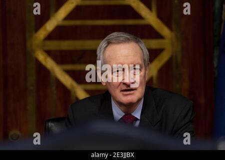Sen. Mike Crapo (R-Idaho) speaks with a reporter during a series of ...