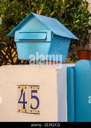 Blue mailbox on the white wall with number forty five, Portugal, West ...