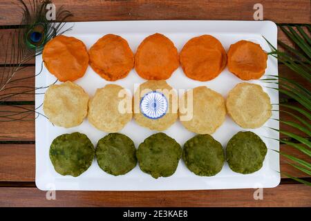 India tricolor / tricolour food breakfast of spinach puri, carrot puri ...
