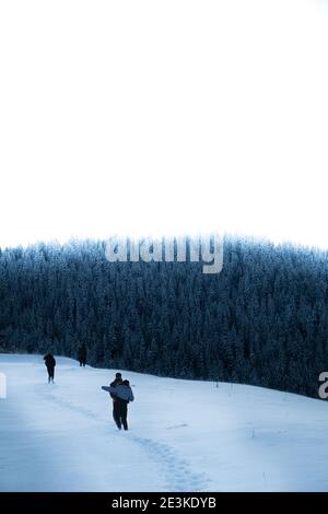People walking trough the snow Stock Photo - Alamy