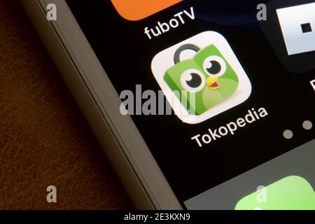 Smartphone with logo of Indonesian e-commerce company PT Tokopedia in ...