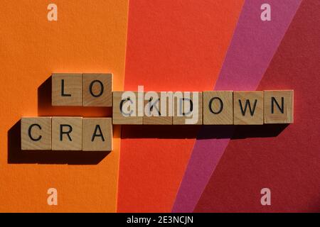 Crackdown, word in wooden alphabet letters isolated on colourful ...