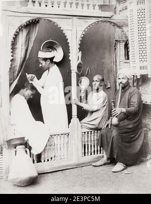 Vintage 19th century photograph: Zangaki studio Cairo Egypt. Barber at ...