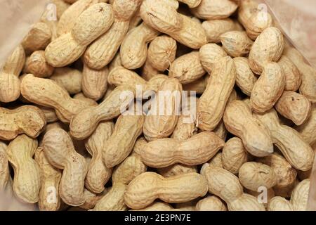 A nylon bag of peanuts in shell Stock Photo - Alamy