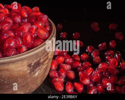 Peeled pomegranate fruit. Pomegranate fruit in a clay bowl. Fron Stock ...