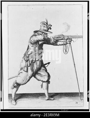 Man shooting rifle resting on support Stock Photo - Alamy