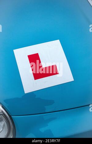 Learner driver L plate on small blue Fiat car bonnet Stock Photo - Alamy