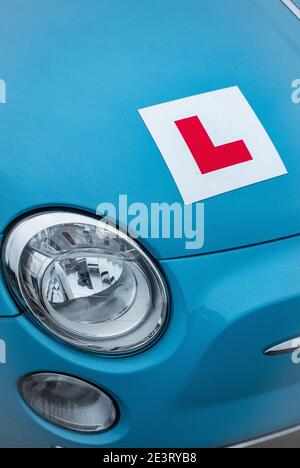 Learner driver L plate on small blue Fiat car bonnet Stock Photo - Alamy