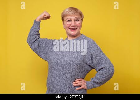 Middle age blonde woman over isolated background shocked covering mouth ...