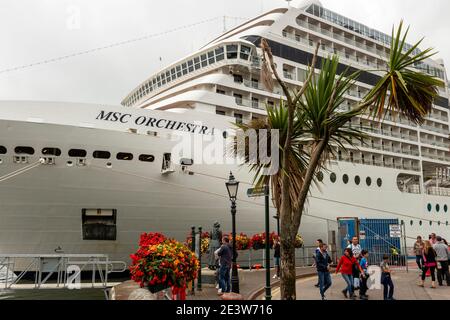 MSC Orchestra cruise ship docking and international flags at Cobh ...
