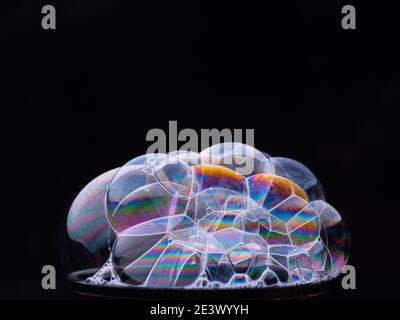 Soap bubbles isolated on a black background. Copy space Stock Photo - Alamy
