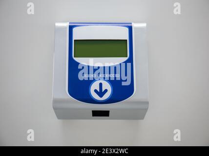 Price check machine on wall Stock Photo - Alamy