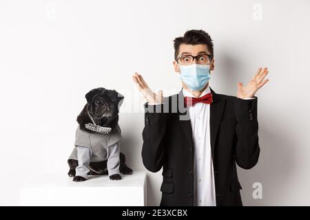 Coronavirus, pets and celebration concept. Amazed young man in face ...