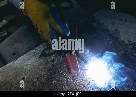 young foreman doing electrical welding Stock Photo - Alamy