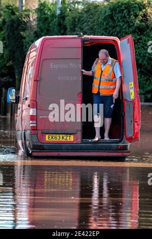 A Parcelforce delivery van is stranded in flood water in Hereford as ...