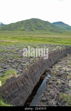 DONEGAL, IRELAND - Peat harvest for fuel, in peatland bog Stock Photo ...