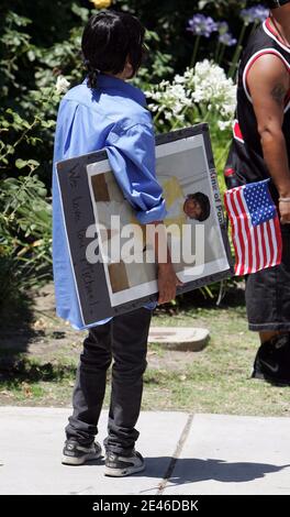 Fans and Media wait outside the entrance to the Jackson family compound ...
