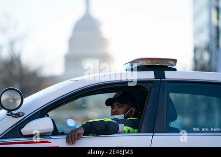 A Capitol Police Officer looks out a window, Monday, Jan. 26, 2026, in ...