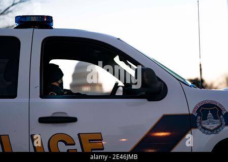 A Capitol Police Officer looks out a window, Monday, Jan. 26, 2026, in ...