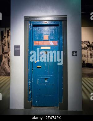 the changi prison cell door in National Museum of Singapore. It was ...