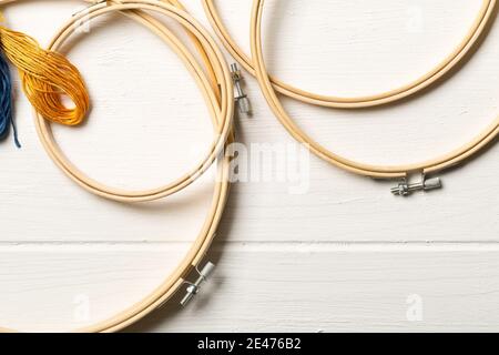 Set of round embroidery or stitching frames over white background with ...