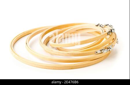Set of round embroidery or stitching frames over white background with ...