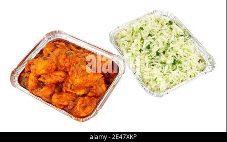 Chicken curry take away meal with rice in foil containers isolated on a ...