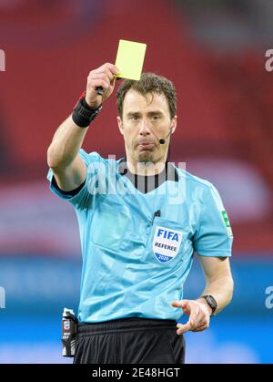 Referee Felix Zwayer, of Germany, a yellow card to Australia's Jacob ...