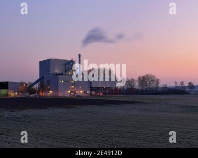 Smoking chimney of the waste incineration plant, view from the frozen ...