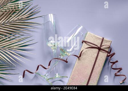 Glasses of champagne and red ribbons on golden background Stock Photo ...