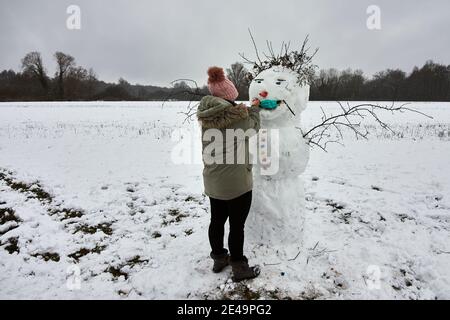 Winter holidays and covid-19 concept. Happy man in face mask and santa ...