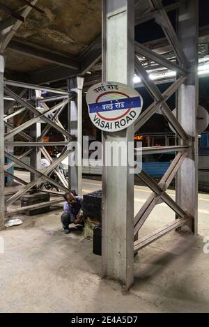 Railway station staff writing name of newly joined loco pilot on a line ...