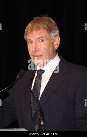 Guest of honor actor Harrison Ford takes a sip of coffee during a press ...