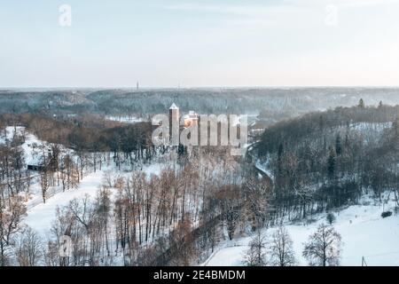 Aerial shot of snow-covered Turaida castle in Sigulda, Latvia on a ...