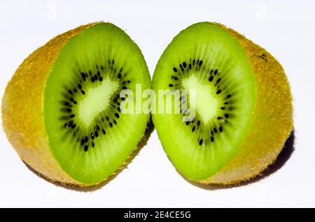 Parts of a kiwi on a white background Stock Photo - Alamy