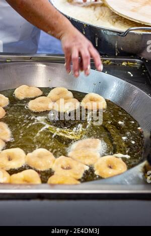 Closeup shot of the process of making doughnut or donuts Stock Photo ...