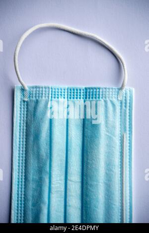 Protective medical mask on a blue background. Virus and flu protection ...