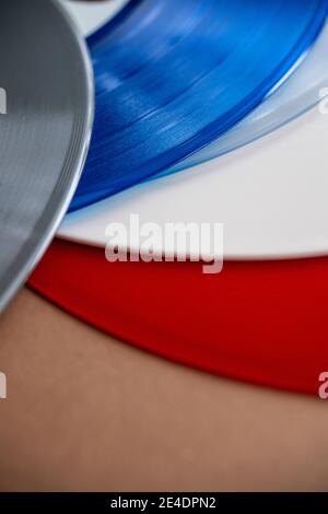 A collection of different coloured vinyl records Stock Photo - Alamy