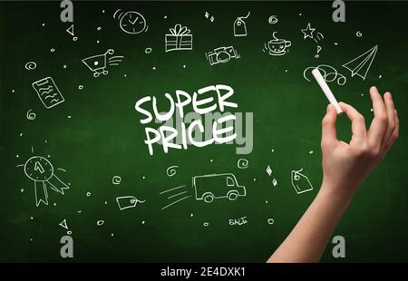 Hand drawing SUPER PRICE inscription with white chalk on blackboard ...