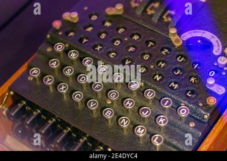 An Enigma machine rotor on display showing the internal wiring in ...