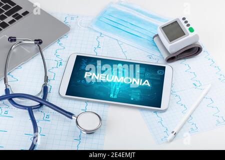 Tablet pc and doctor tools with PNEUMONIA inscription, coronavirus ...