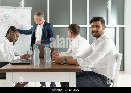 Indian startup leader man instructing team, speaking before employees ...