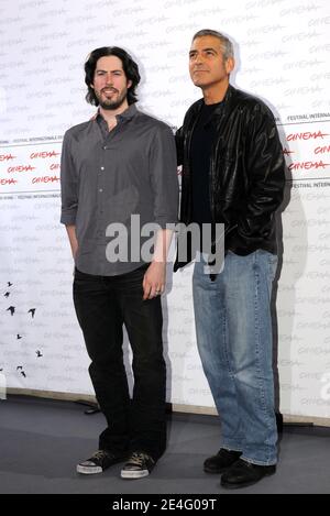 Director and actor George Clooney, left, and actor John Goodman attend ...